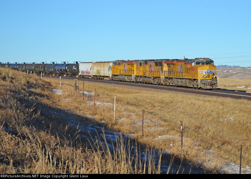 UP 8029 leads an eastbound ethanol train towards Cheyenne, both buffer cars were on the head end.